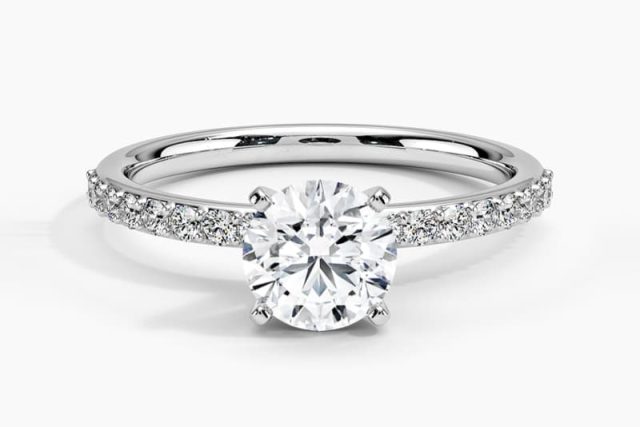 In a pavé diamond ring setting small diamonds lined across the band ...